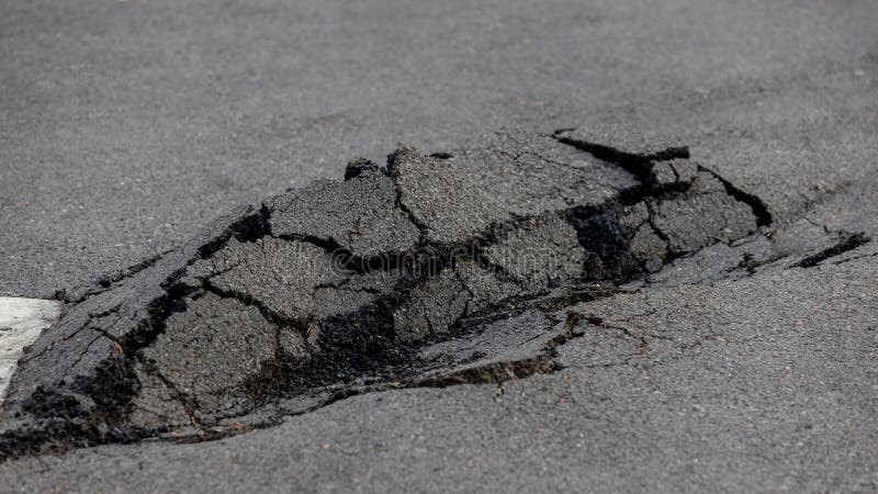 Asphalt Road Damaged. Cracked Road after Earthquake. Poor Asphalt ...