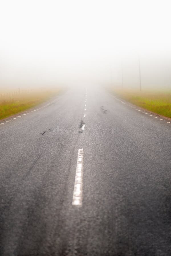 Asphalt road in fog stock photo. Image of transportation - 25458934