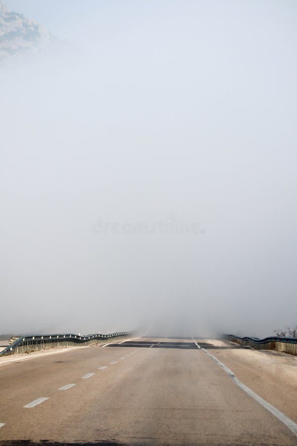 Asphalt Road into the Fog in the Mountains Springtime View Stock Photo ...