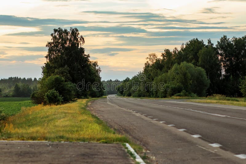 Asphalt Road Going into the Distance on a Summer Evening Stock Photo ...