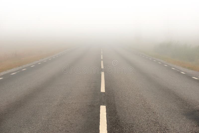Asphalt road in heavy fog stock photo. Image of foggy - 32577910