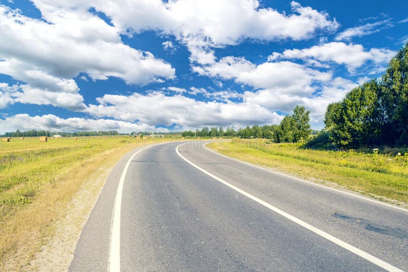 Asphalt Road Leading into the Distance Around the Bend Stock Image ...
