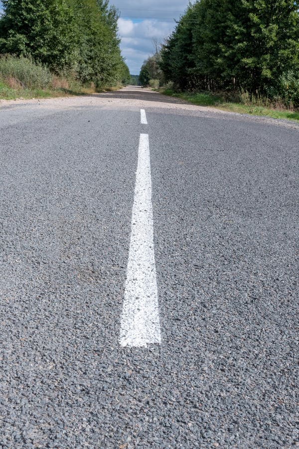 The Asphalt Road with Markings Ends and Regular Gravel Begins. Stock ...