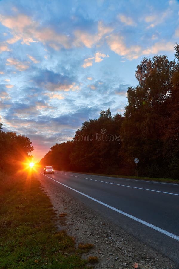 Asphalt Road in Motion with Trees Against a Night Sky with Bright ...