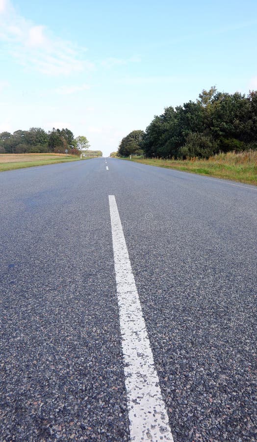 Asphalt Road without People in the Plain and it Seems To Have No End ...