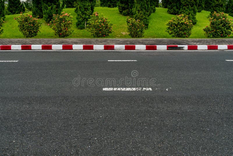 Asphalt Road with Red and White Concrete Curb Stock Image - Image of ...
