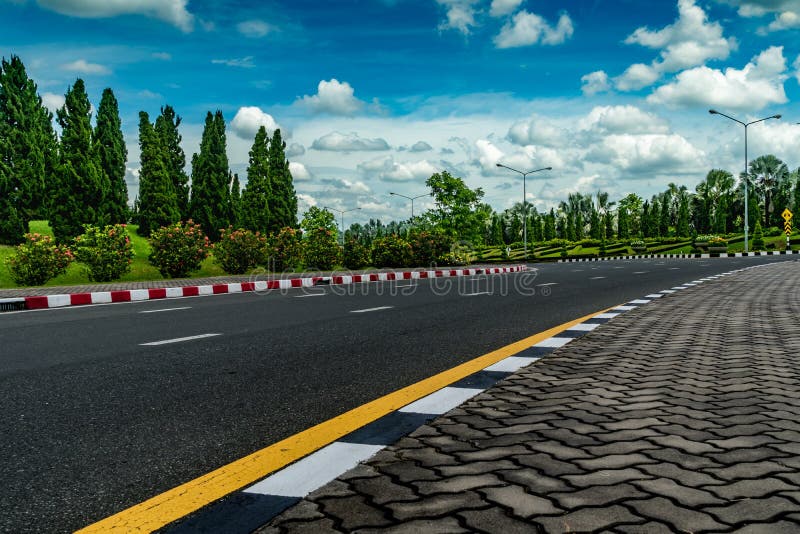 Asphalt Road with Red and White Concrete Curb Stock Photo - Image of ...