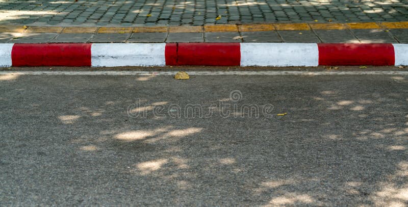 Road with Red and White Curb Stock Photo - Image of street, city: 111122830