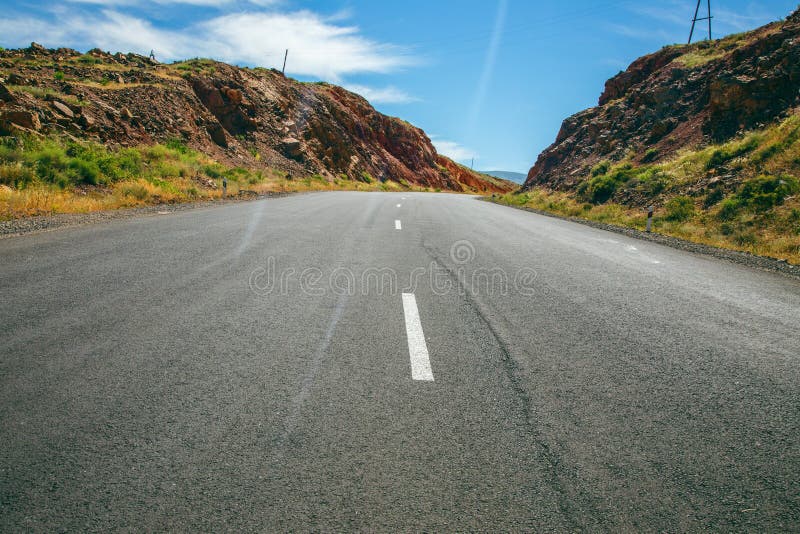 Asphalt road and rocks stock image. Image of empty, motion - 255828565