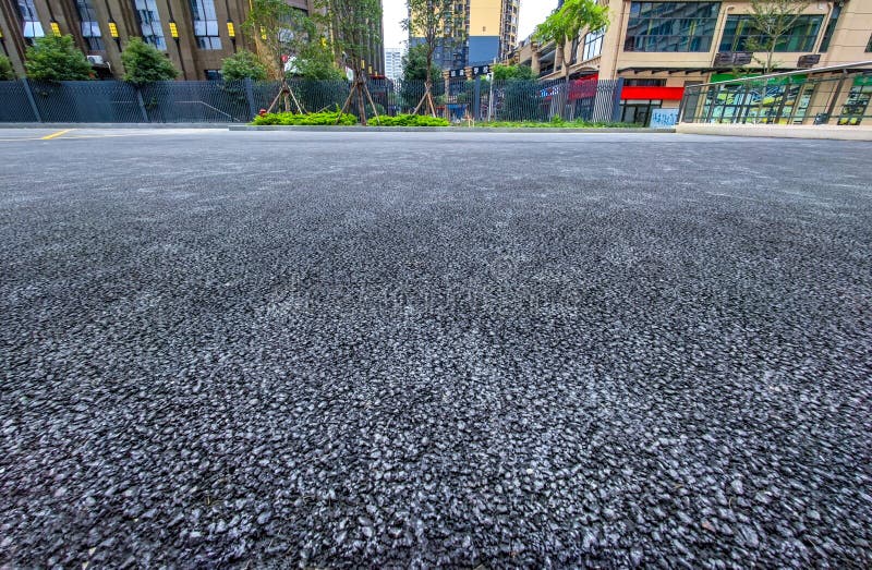 Asphalt Road Surface with Cityscape Background, Closeup of Photo Stock ...
