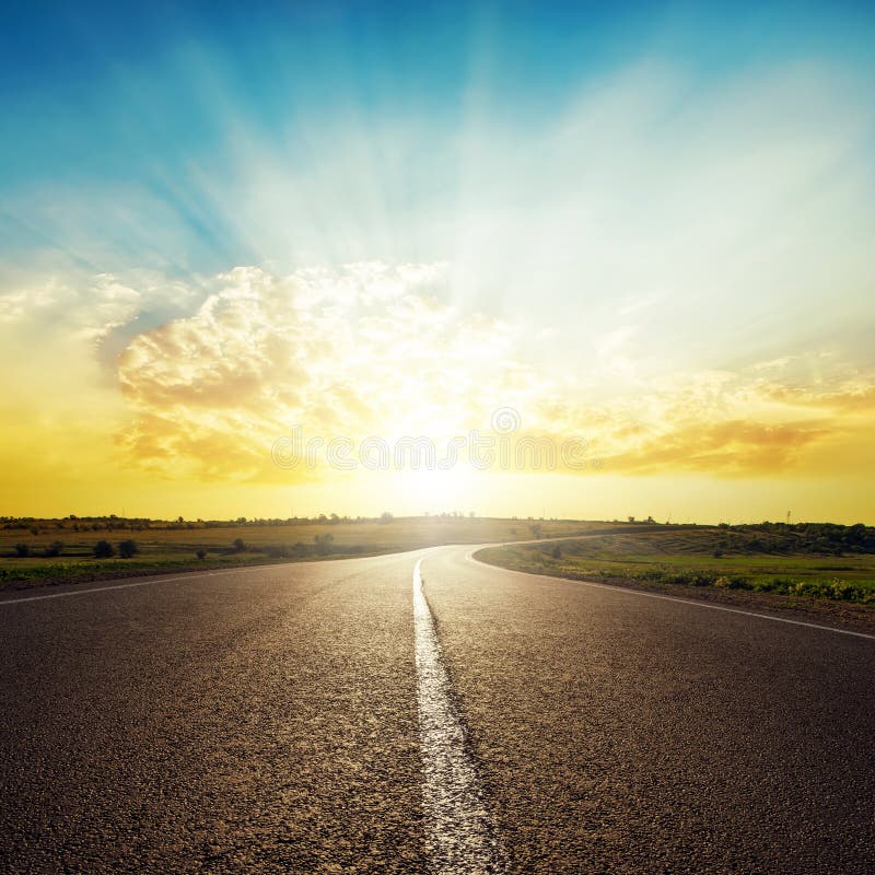 Asphalt Road To Horizon and Sunset in Clouds Stock Image - Image of ...