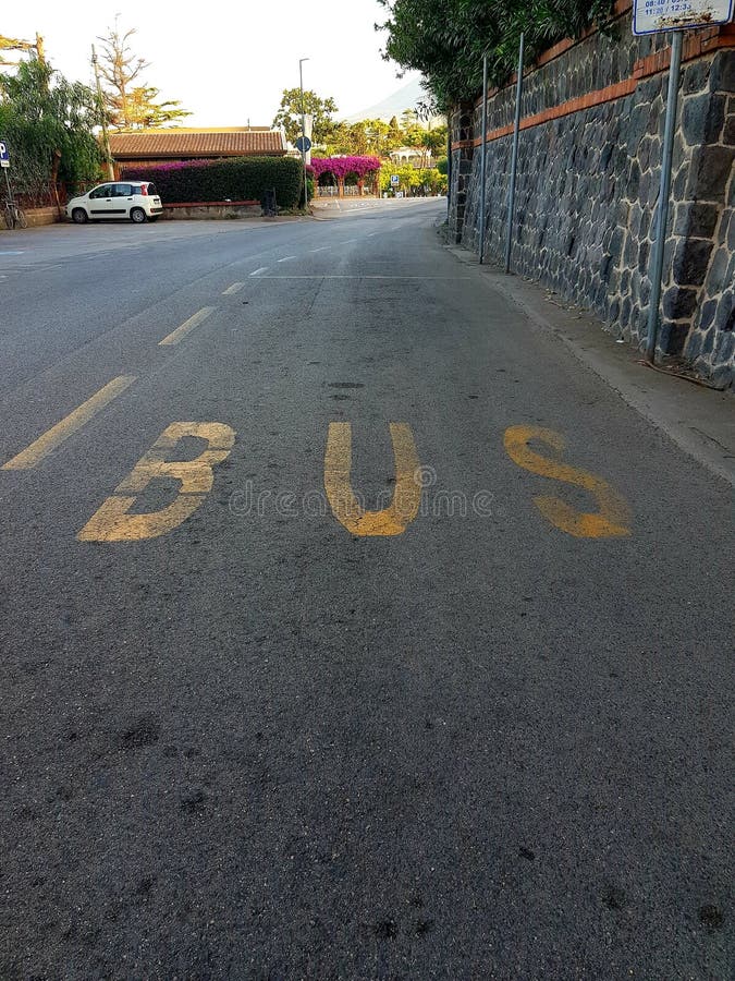 Asphalt Road with the Word Bus Written in Yellow on the Road Stock ...