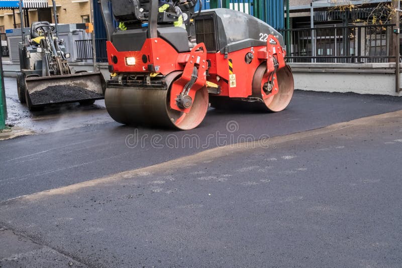 An asphalt roller stock image. Image of activity, street - 165508983