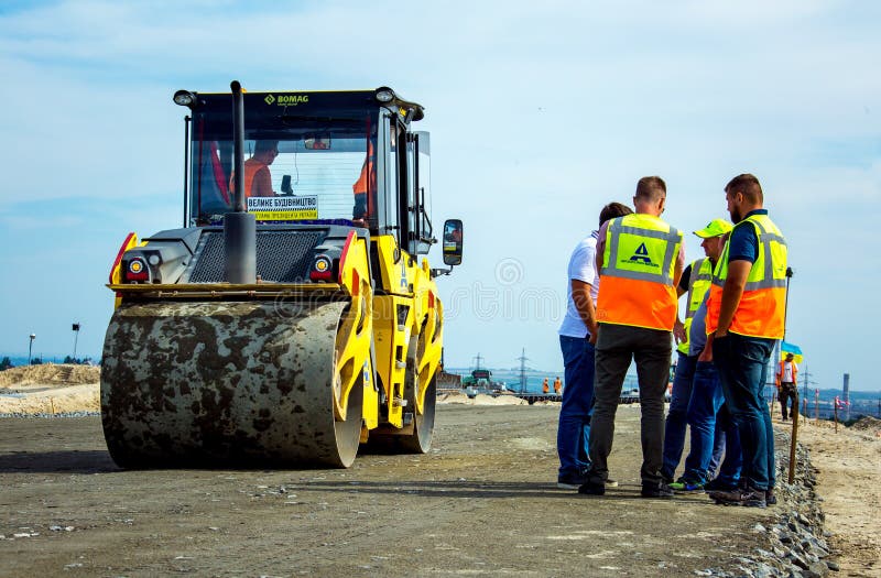Asphalt Roller Rolling Asphalt on the New Road. Road Construction ...