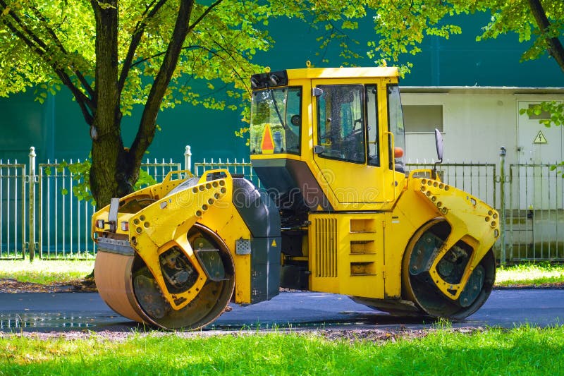 Asphalt Roller Working on Pavement of a Road in the City. Stock Image ...
