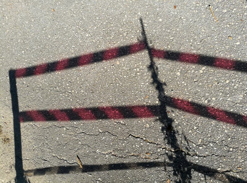 Asphalt with Shadow of Security Tape Stock Image - Image of blocking ...