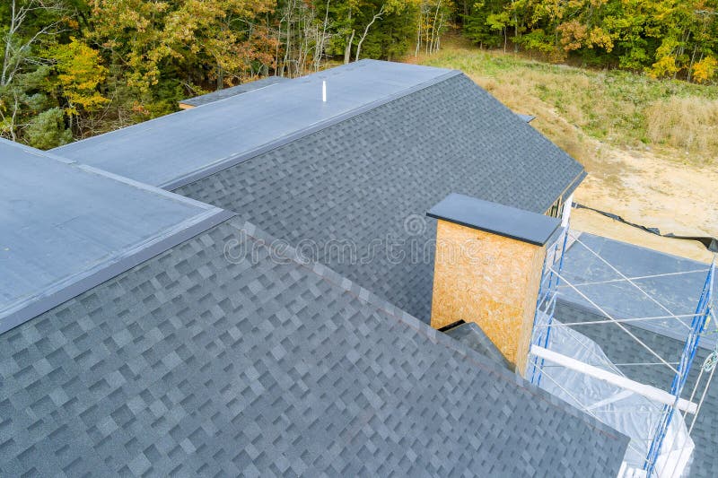 An Asphalt Shingle Roof Covers Roof of a Newly Built House Stock Photo ...