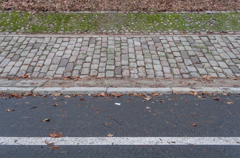 Asphalt Side Road and Cube Stone Fence with Autumn Fallen Leaf Stock ...
