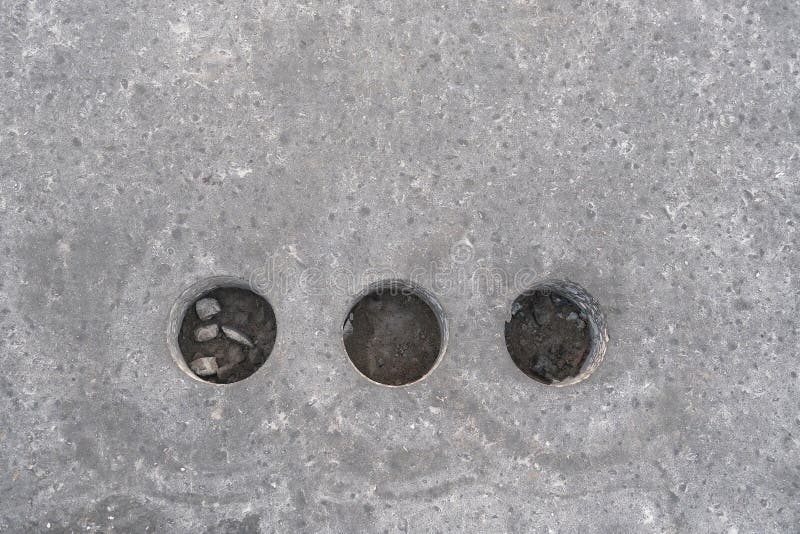 Asphalt Surface Showing Three Core Drill Holes. Samples for Determining ...
