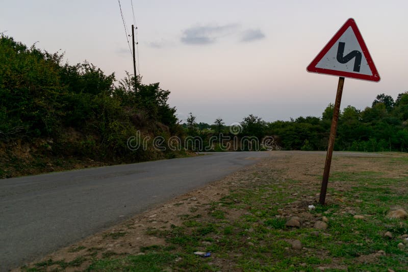 Asphalted Mountain Road with Sharp Sharp Turn Near the Cliff. Traffic ...
