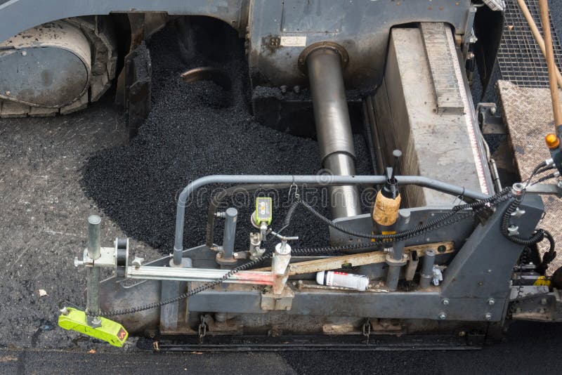 Working asphalting machine stock photo. Image of paving - 148671072