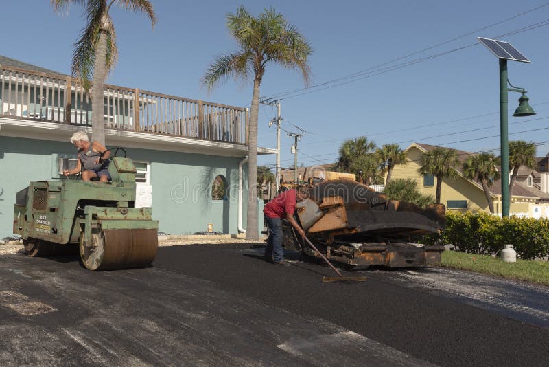 Asphalting Workers Work on a Driveway in America. Editorial Photography ...