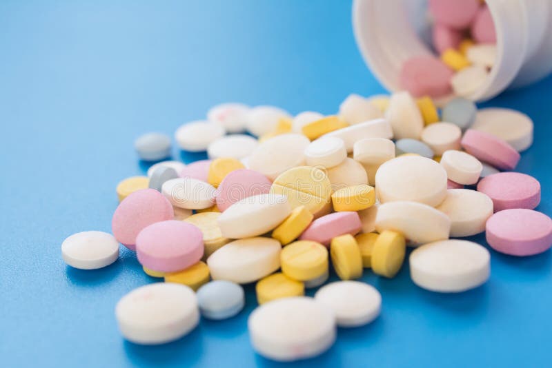 Aspirin Tablets on a Blue Background Stock Image - Image of fragment ...