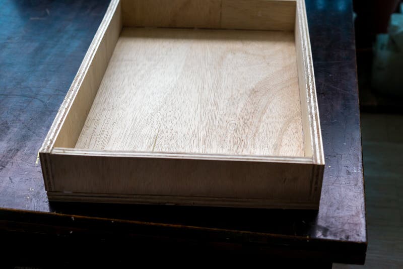 Assembles Wooden Drawers of New Furniture in the Workshop Stock Photo ...