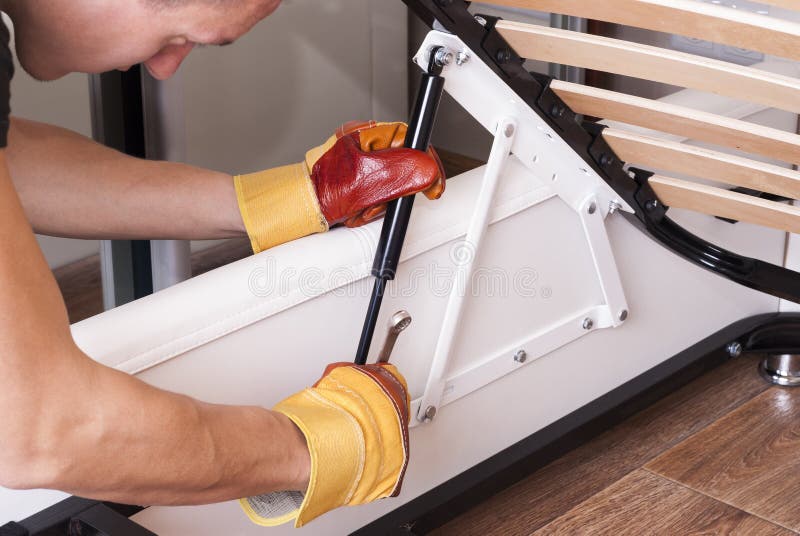 Assembling bed furniture stock image. Image of assemble - 89225603