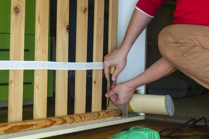 Assembling a Bed at Home. Screwdriver Work Stock Photo - Image of ...