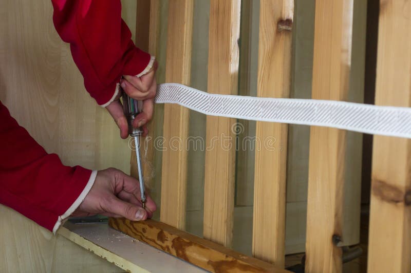 Assembling a Bed at Home by a Worker Using a Screwdriver Stock Image ...
