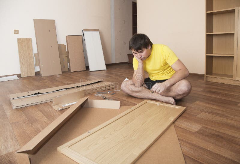 Assembling furniture stock image. Image of housework - 52300539
