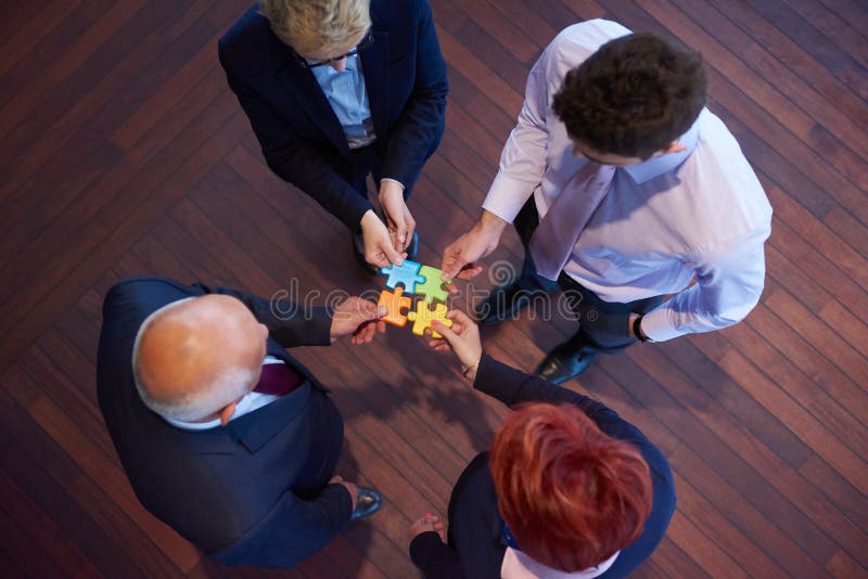 Assembling jigsaw puzzle stock photo. Image of leisure - 64555796