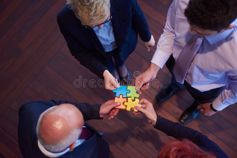 Assembling jigsaw puzzle stock image. Image of inspiration - 64556499