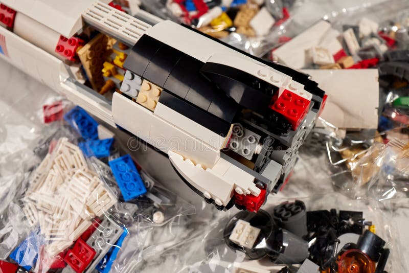 Assembling a Rocket Constructor. Colored Plastic Small Blocks. Stock ...