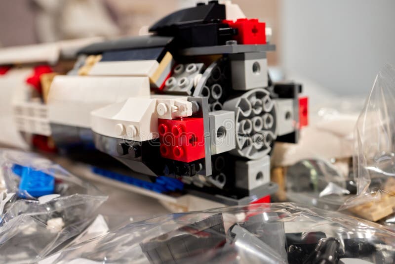 Assembling a Rocket Constructor. Colored Plastic Small Blocks. Stock ...