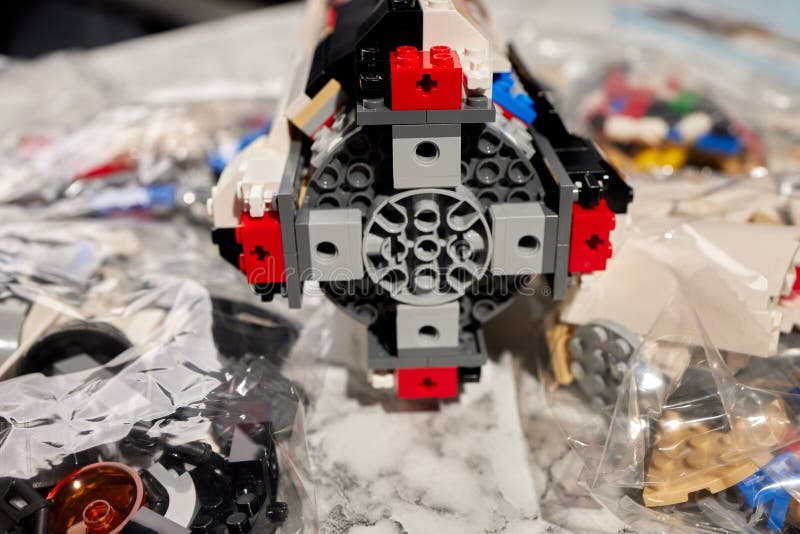 Assembling a Rocket Constructor. Colored Plastic Small Blocks. Stock ...