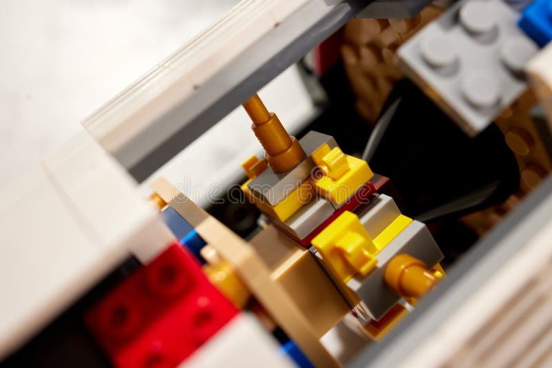 Assembling a Rocket Constructor. Colored Plastic Small Blocks. Stock ...