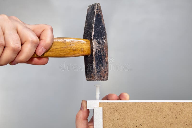 Installation of Drawer Using Plastic Dowel Pin and Hammer. Stock Photo ...