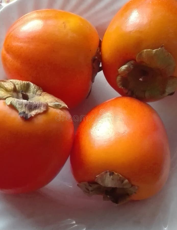 Assembly of Four Kakis stock photo. Image of fruit, japanese - 175657404