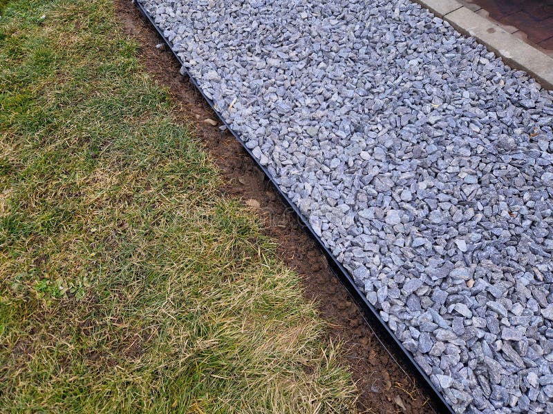 Assembly of Garden Curbs Made of Black Plastic. the Curb Separates ...
