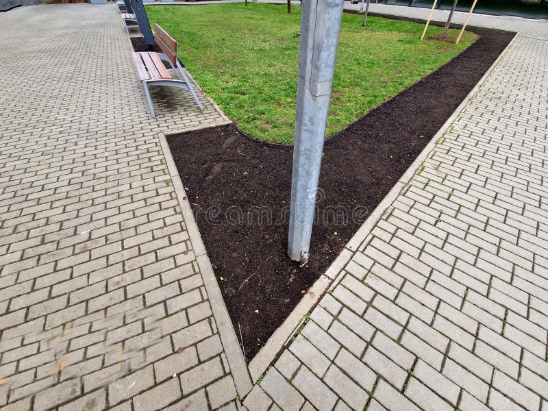 Assembly of Garden Curbs Made of Black Plastic. the Curb Separates ...