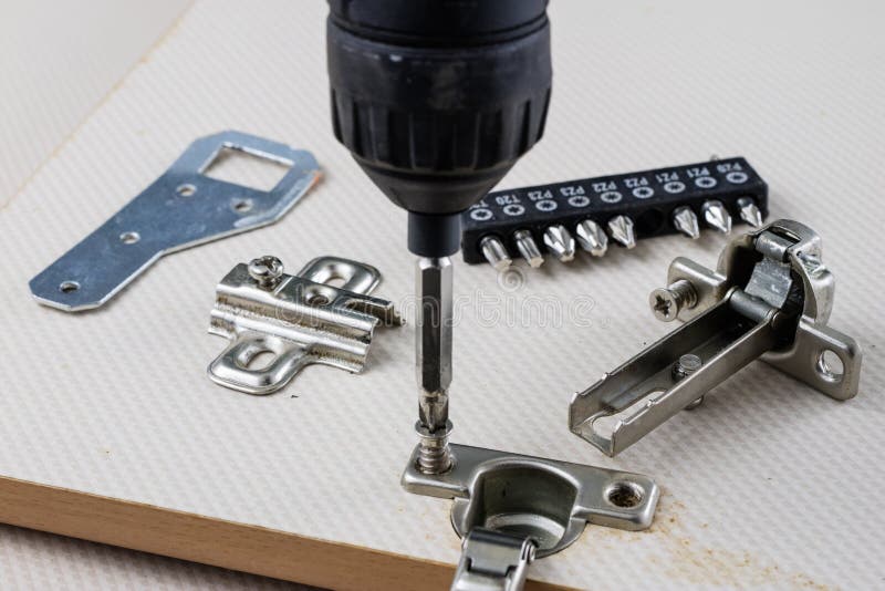 Assembly of Hinges in a Carpentry Workshop. Joinery Accessories Stock ...