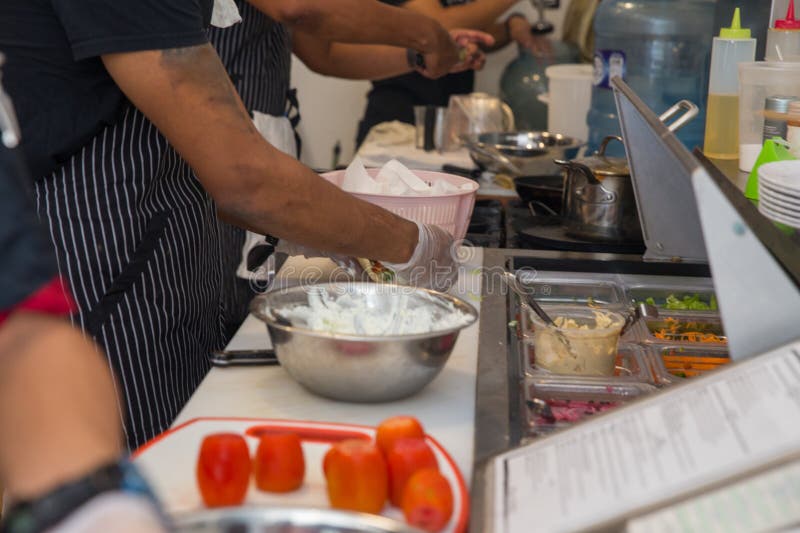 Assembly Line of a Mediterranean Food Stock Image - Image of hands ...
