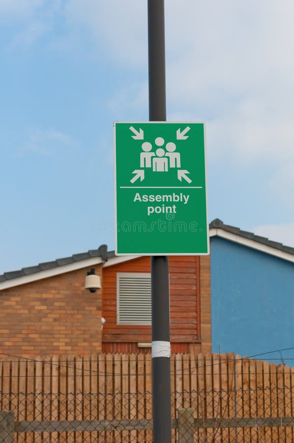 Assembly point sign stock photo. Image of pole, people - 52679488