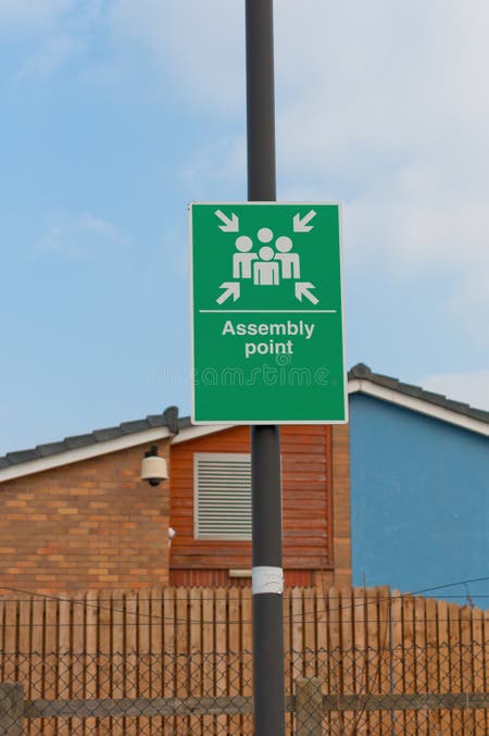 Assembly point sign stock photo. Image of pole, people - 52679488