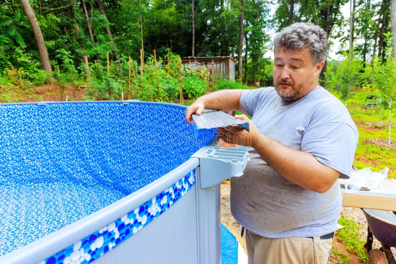 An Assembly of Swimming Pool Made of Construction Ground in Backyard of ...