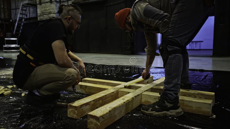 Assembly of Wooden Stage Construction by Young Builders. Media Stock ...