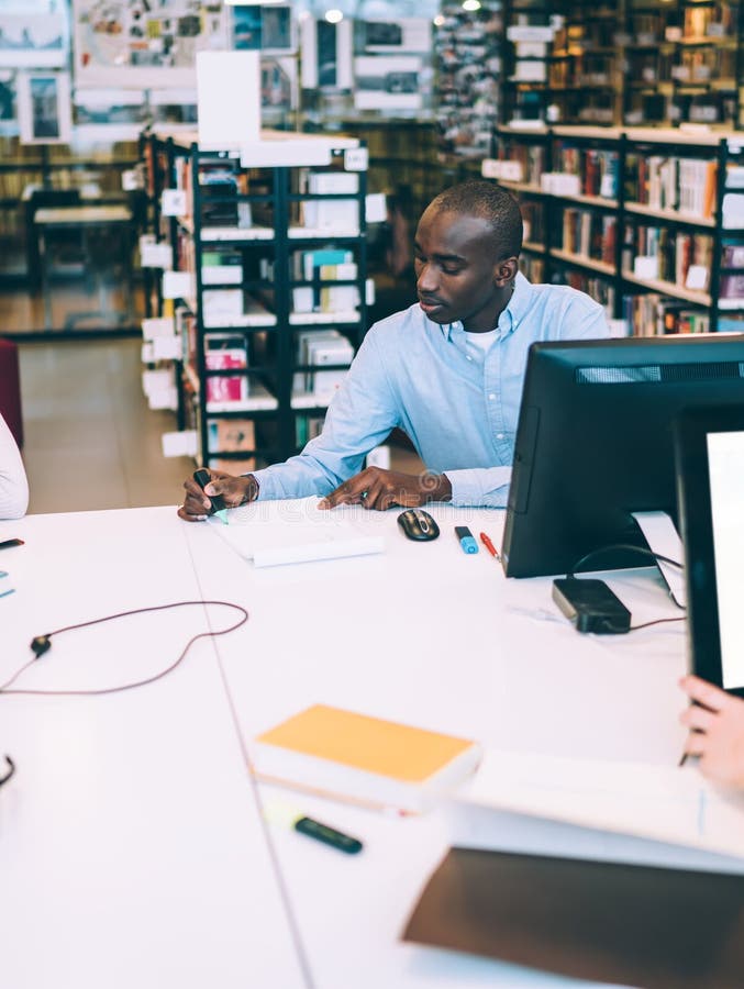 Assiduous Multiracial Students Doing Homework Together and Using ...