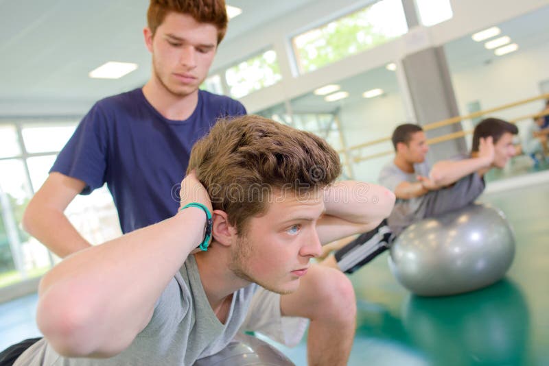 Assistance in the gym stock image. Image of healthy - 117904197